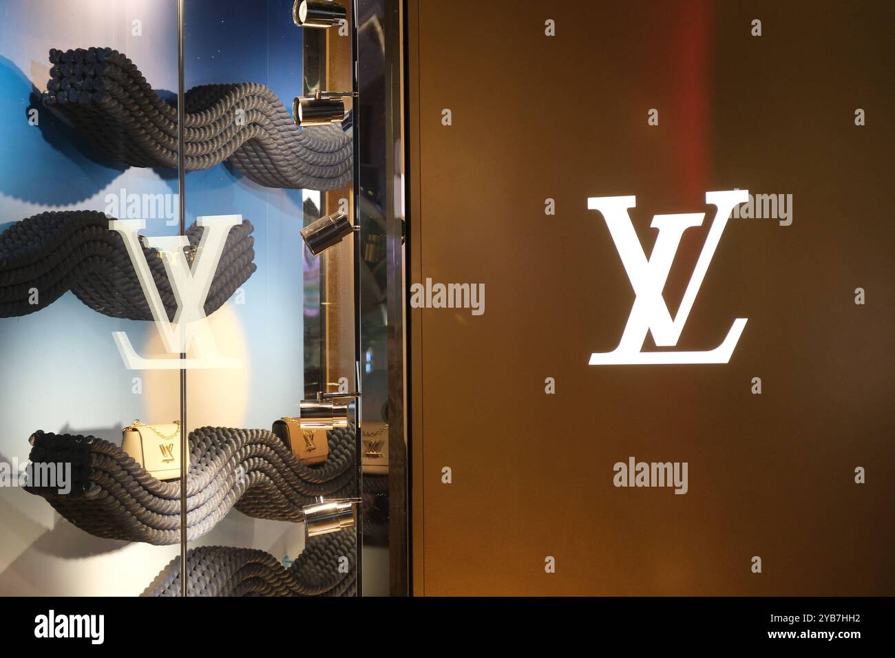 LV Louis Vuitton store brand logo Stock Photo - Alamy