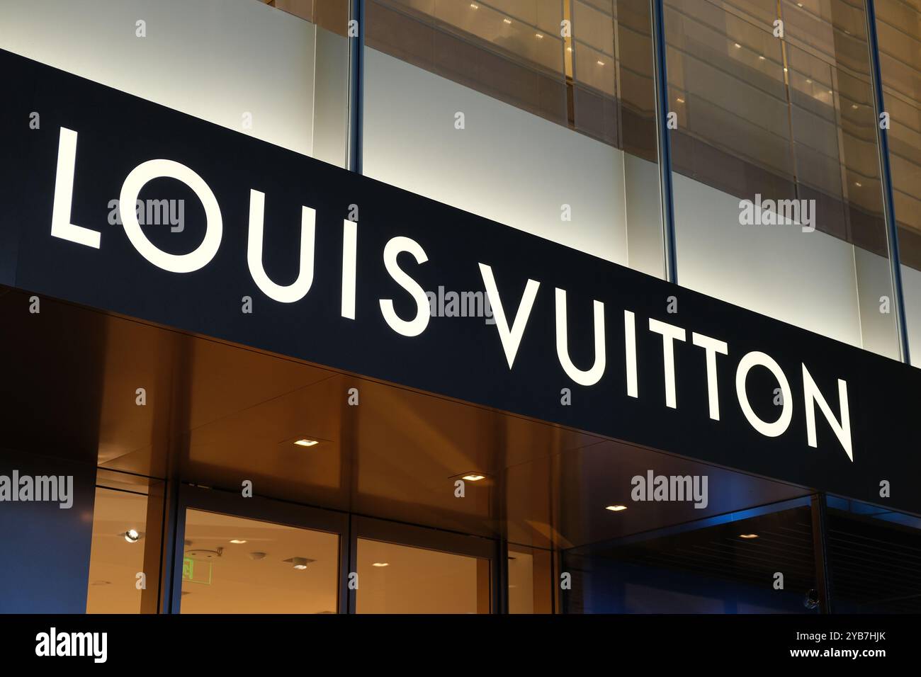 LV Louis Vuitton store brand logo sign Stock Photo - Alamy