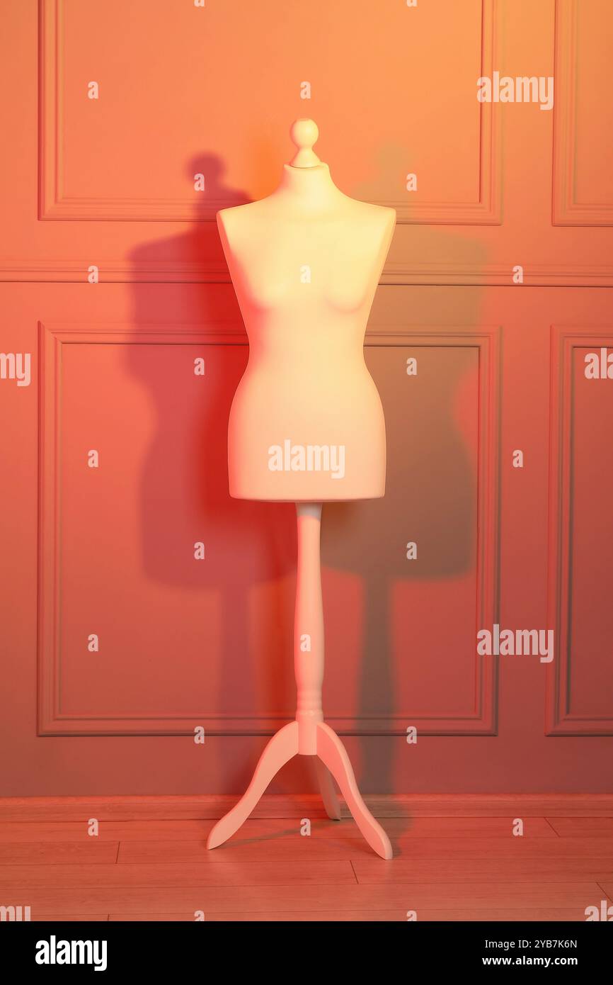 One mannequin near wall in neon lights Stock Photo - Alamy