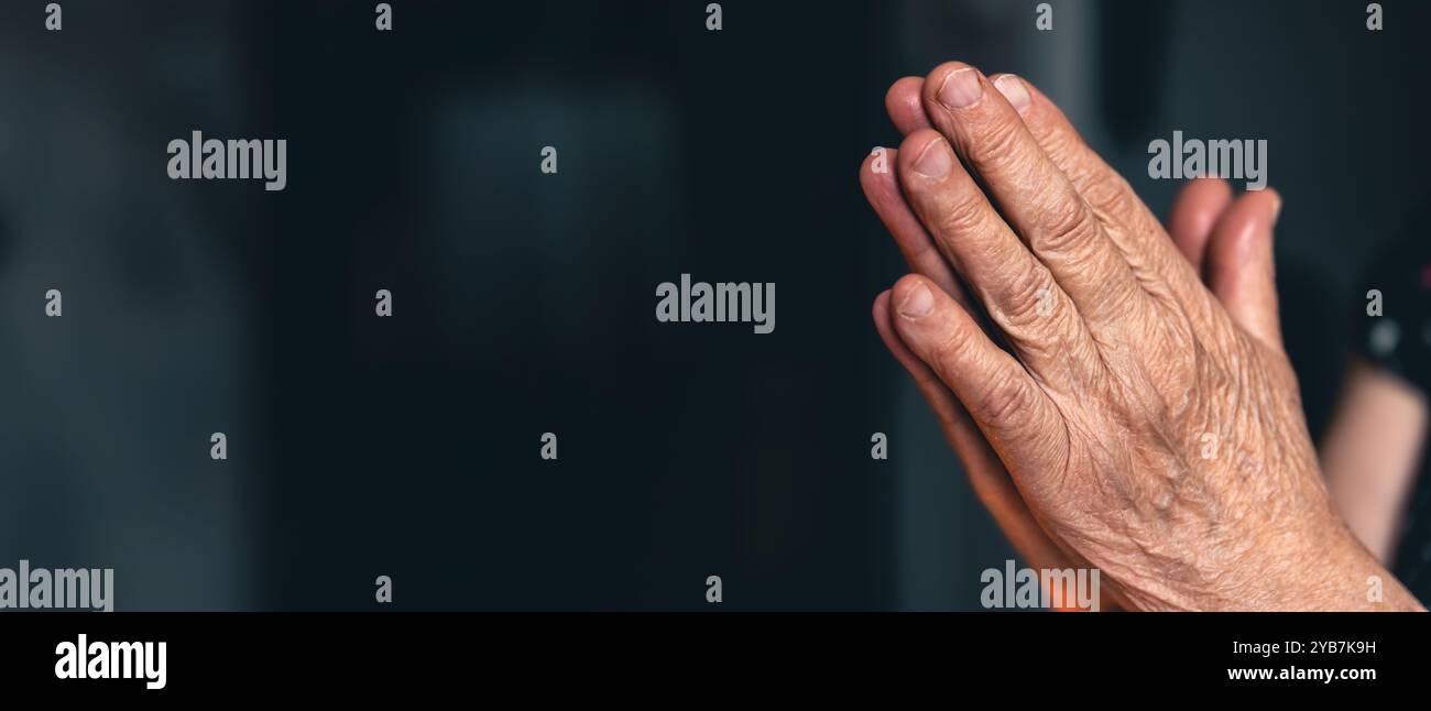 Elderly woman praying with hands. Hands folded in prayer Stock Photo ...