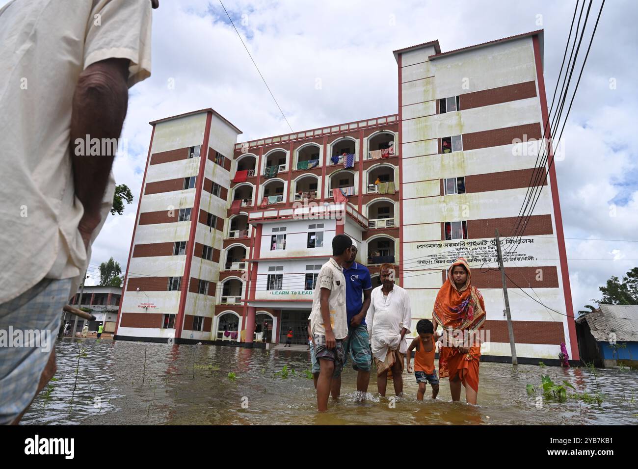 Flood affected peoples are take shelter at a school building in Feni ...