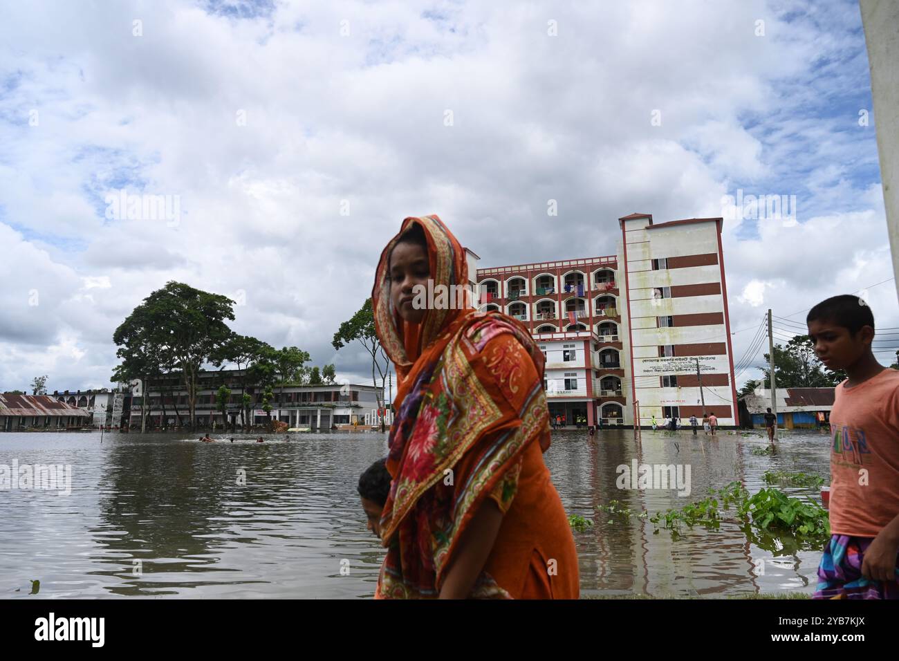 Flood affected peoples are take shelter at a school building in Feni ...