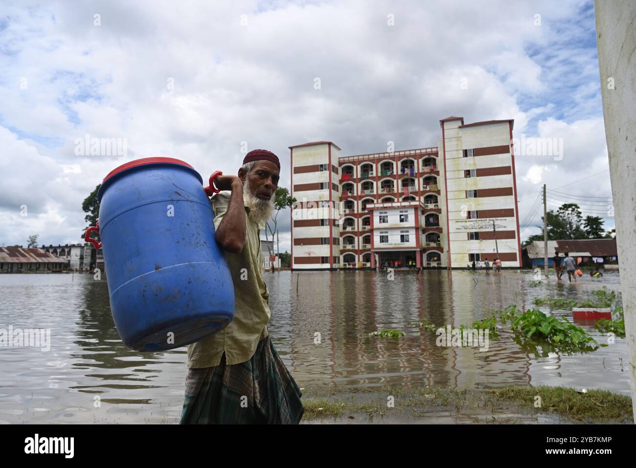 Flood affected peoples are take shelter at a school building in Feni ...