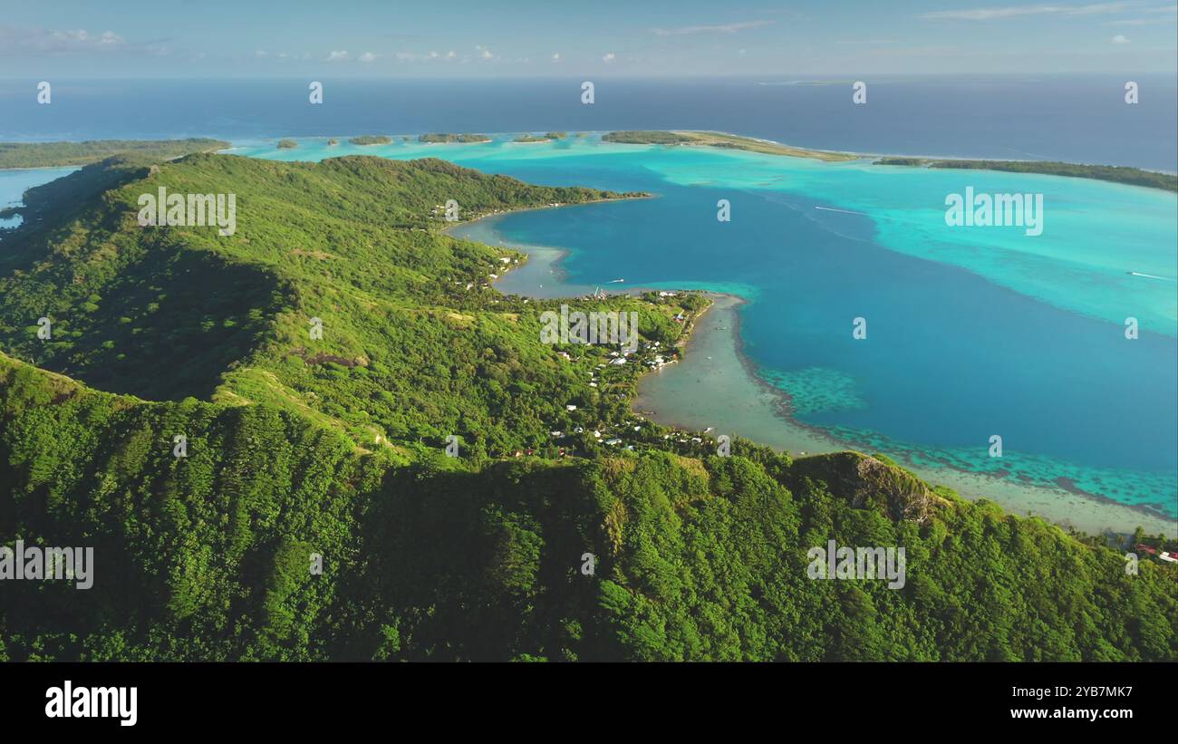 Aerial view Bora Bora green mountain island, turquoise lagoon and coral ...