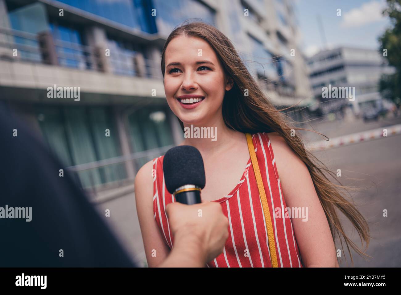 Photo of cute charming popular girl giving interview to journalist ...
