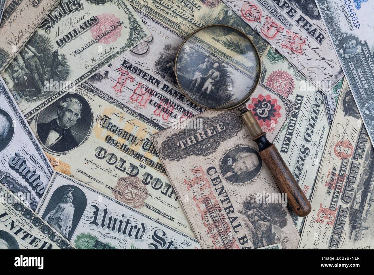 Old US banknotes and silver certificates with silver dollar coins and ...