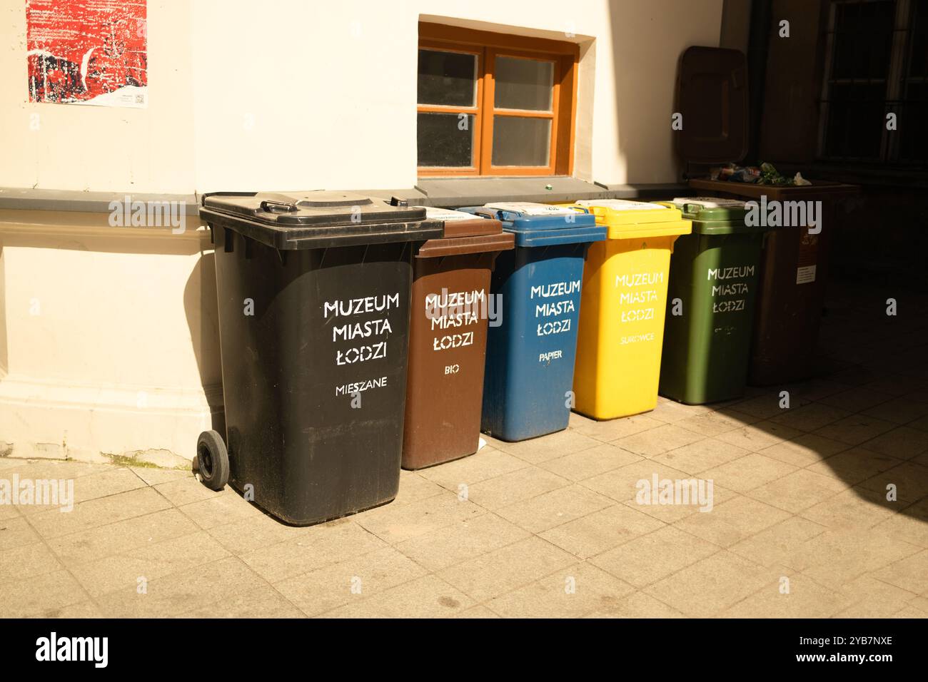 Plastic pollution problem. Large multi-colored garbage plastic bins for ...