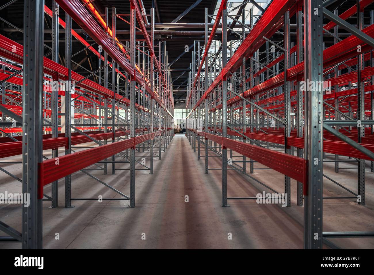 Logistics warehouse concept with empty high pallet racks, shelving ...
