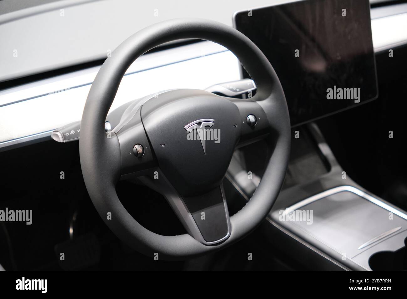 Wuhan,China-May 2nd 2024: Tesla brand logo on steering wheel inside car ...