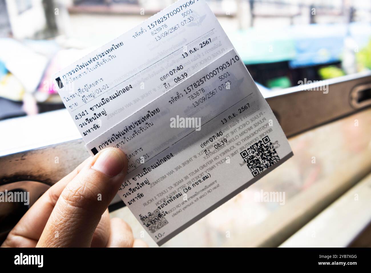 Travelers thai women show paper tickets for passenger train journey ...