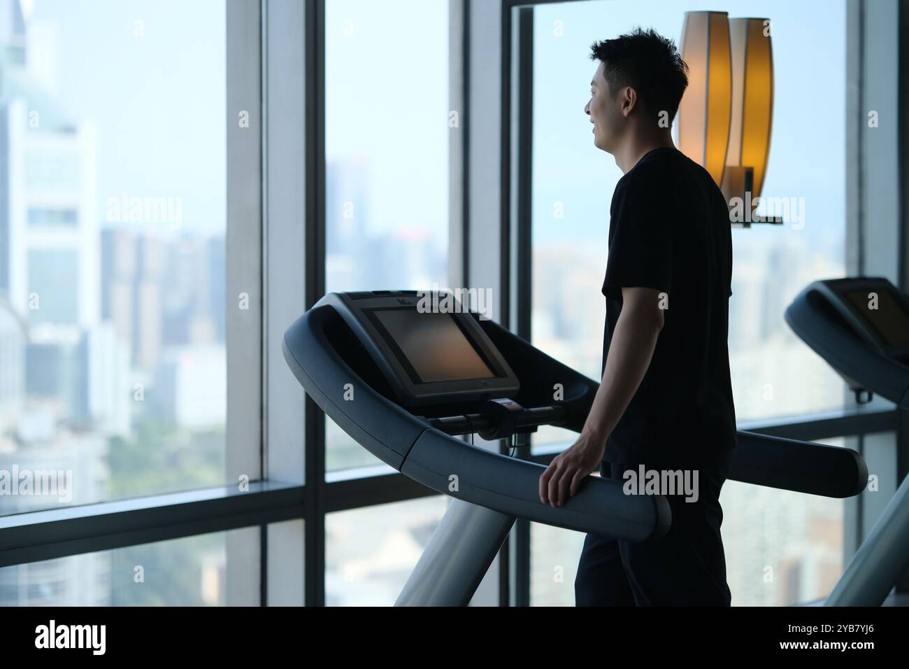 Side view young man walking hi-res stock photography and images - Alamy