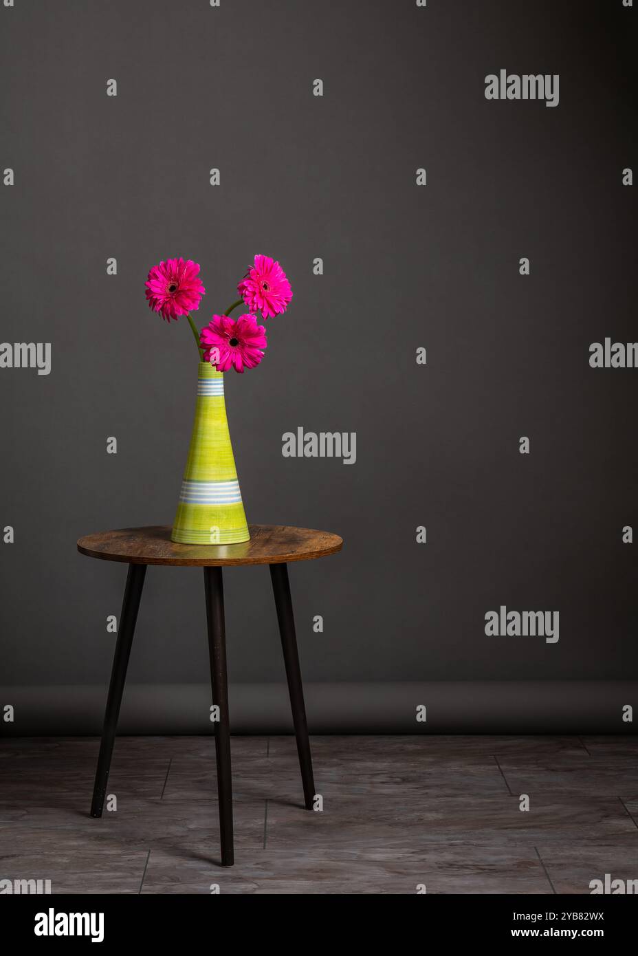 Bright bouquet red daisies in vase on round table. Gerbera. Perfect for ...