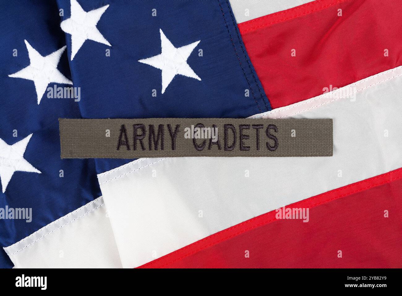 US ARMY CADETS Branch Tape on national USA flag background Stock Photo ...