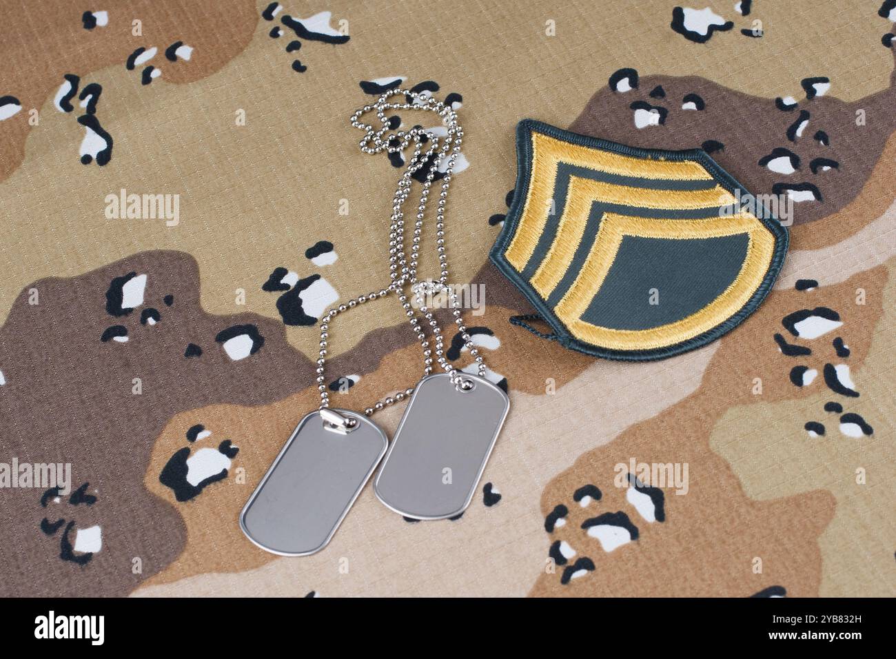 US ARMY Sergeant rank patch and dog tags on desert camouflage uniform ...