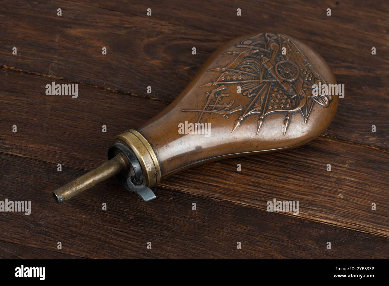 Old west gunpowder flask on wood deck background Stock Photo - Alamy