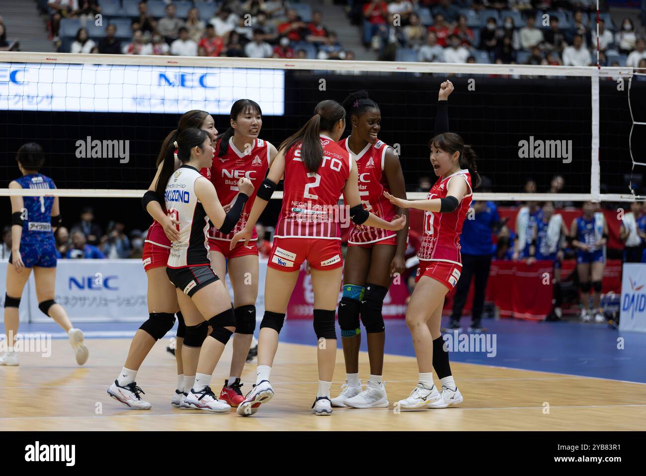 NEC Red Rockets Kawasaki players celebrate scoring a point during the opening match of Daido ...