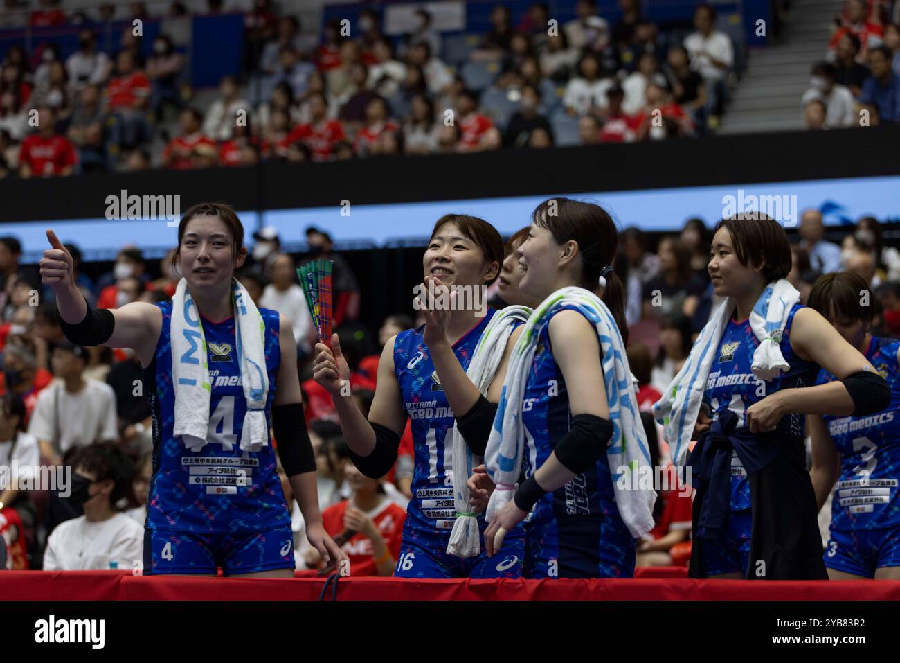 Saitama Ageo Medics players cheer on their teammates during the opening ...