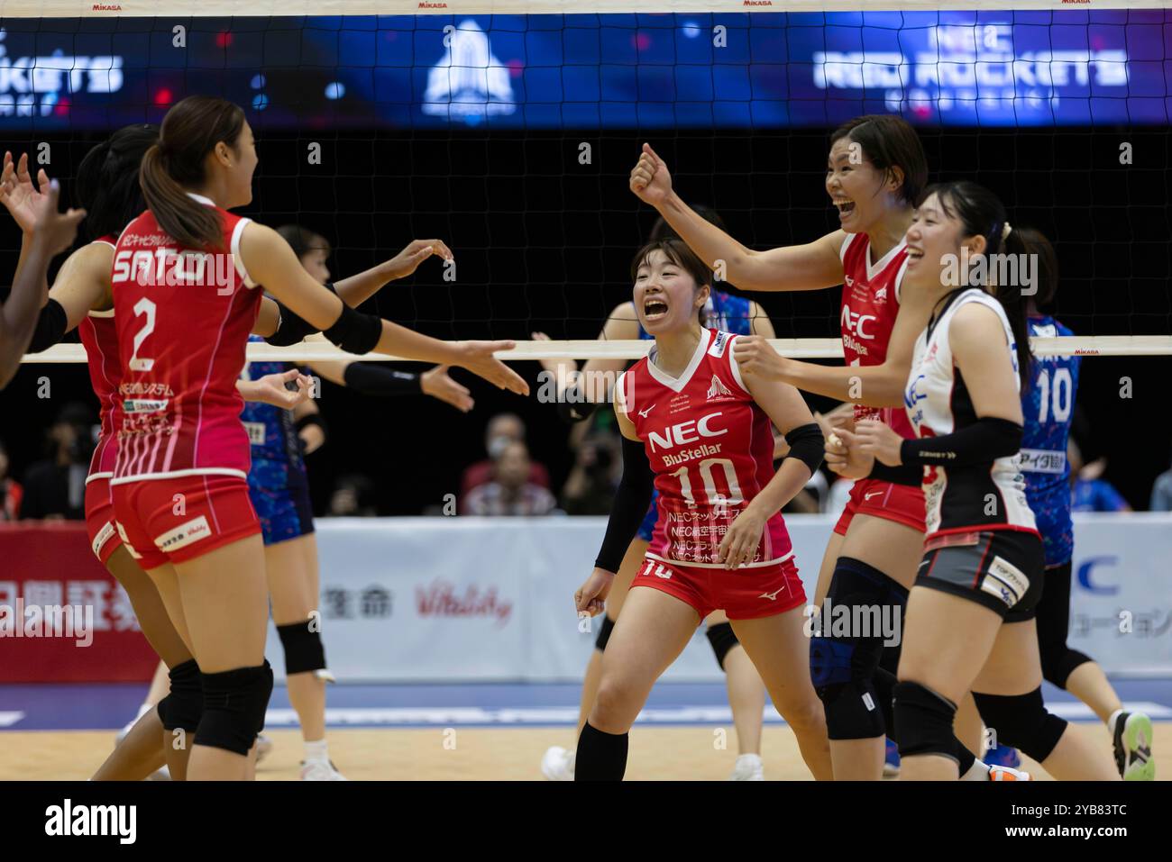 NEC Red Rockets Kawasaki players celebrate scoring a point during the opening match of Daido ...