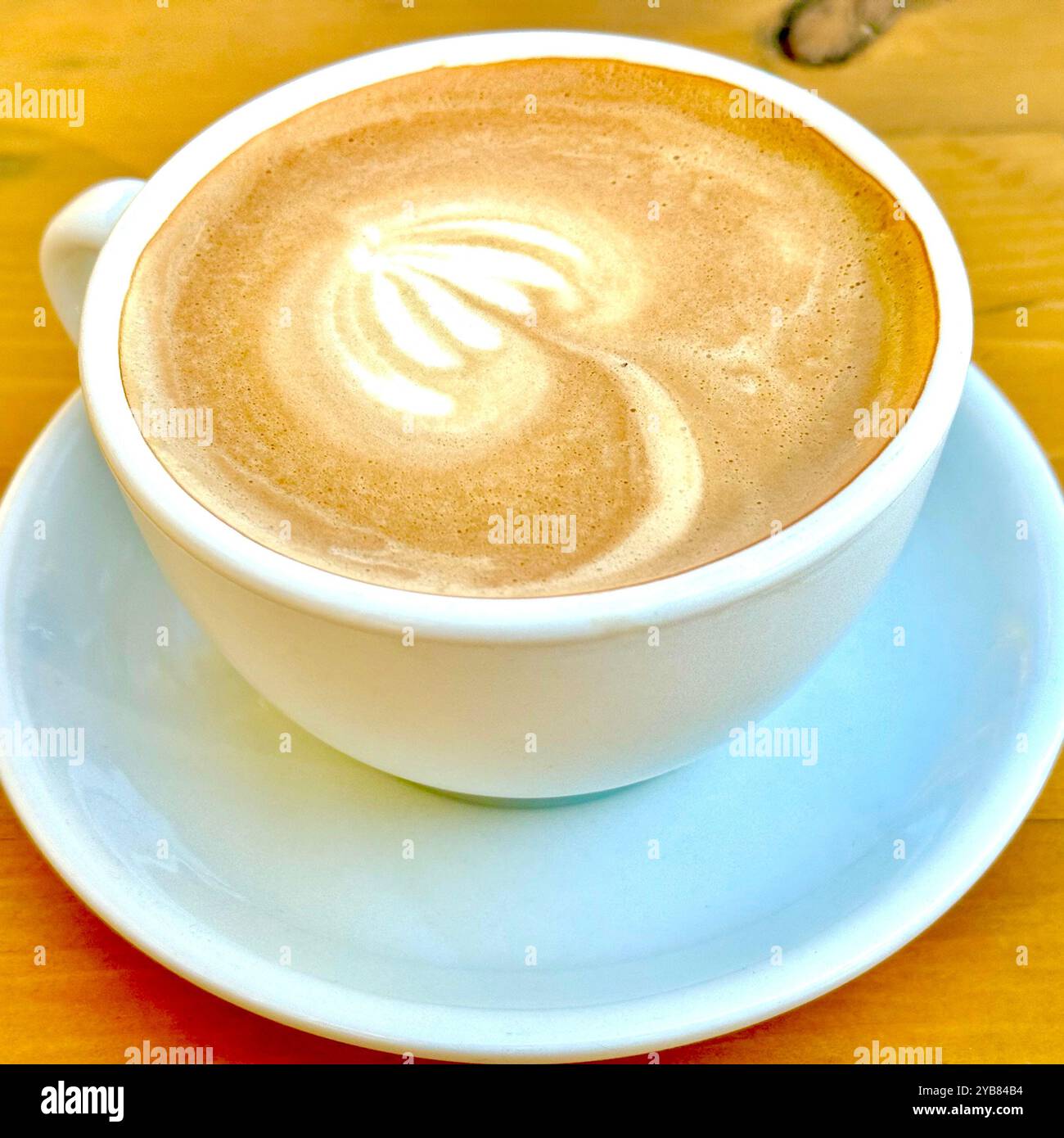 White cup with cortado coffee - on a wood table. No person Stock Photo ...