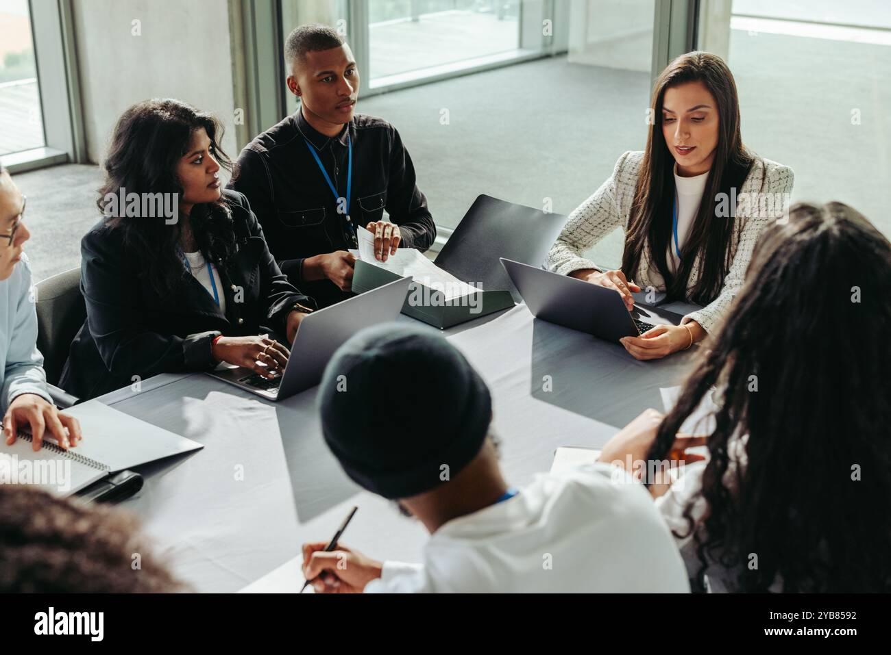 Diverse group of business people collaborating in an office setting ...