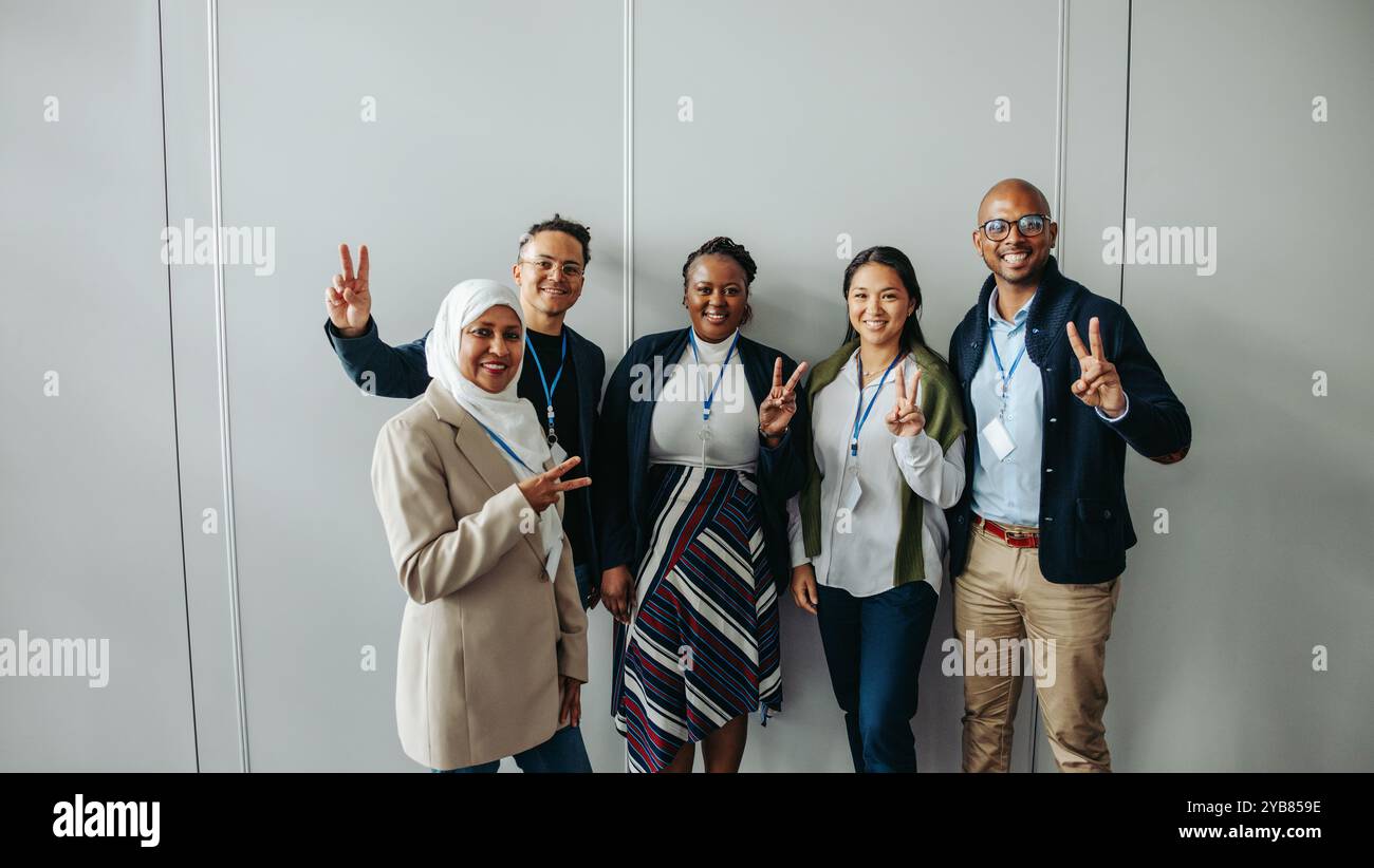 Diverse group of colleagues showcasing teamwork with cheerful ...