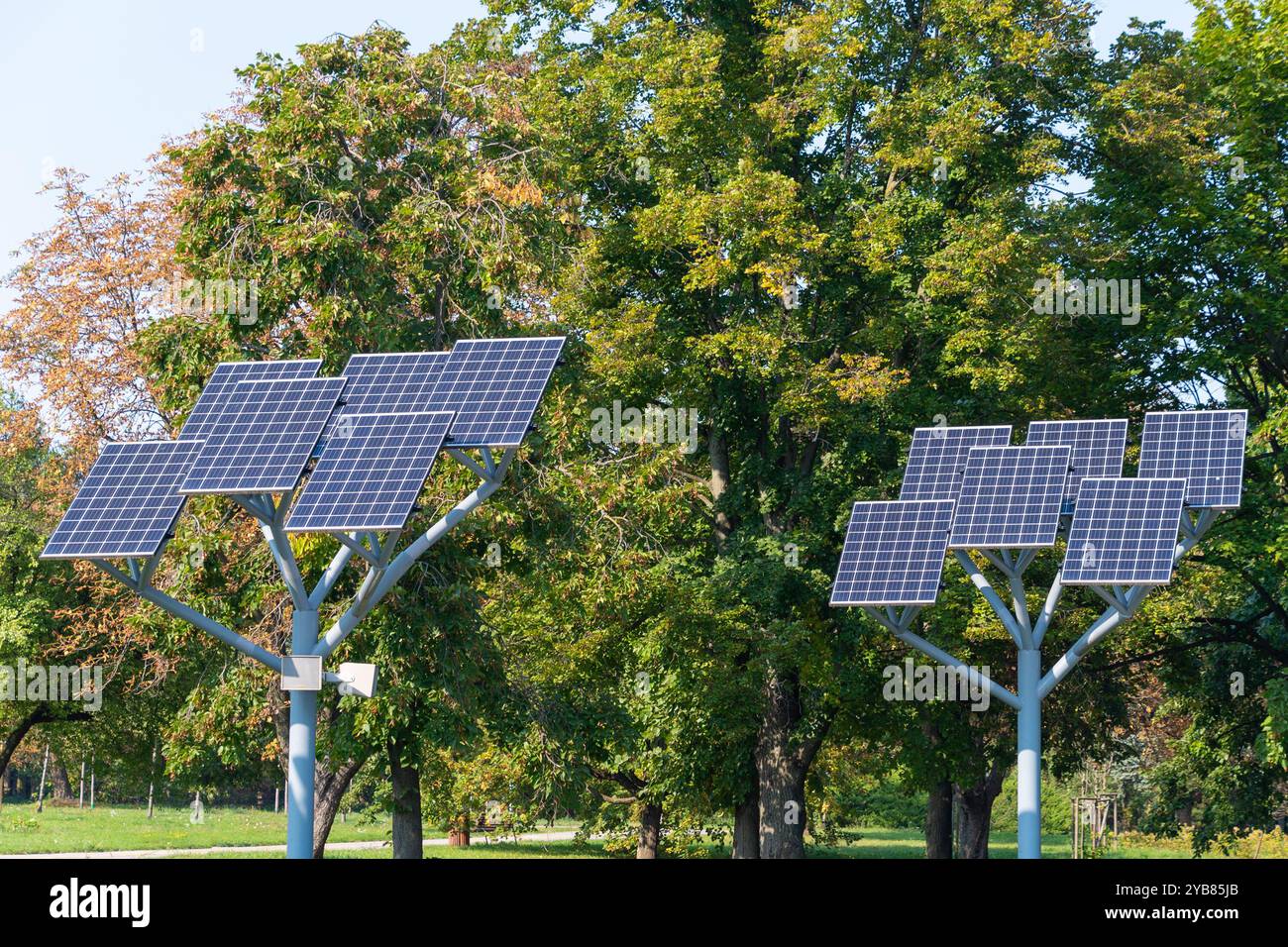 Solar panels in the city park. Sustainable development Stock Photo - Alamy