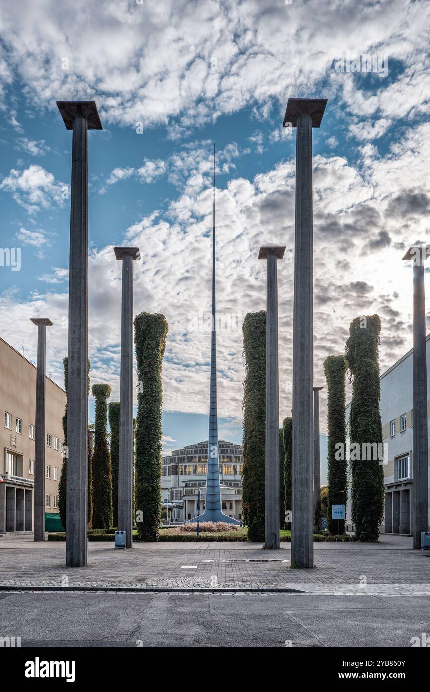 A stunning architectural scene featuring tall, vertical columns against ...