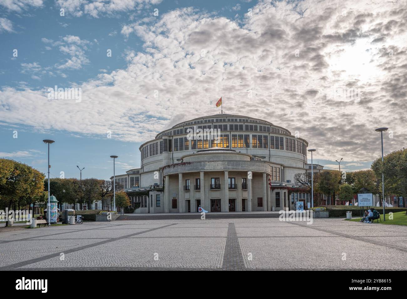 Wide-angle shot of an impressive round auditorium with large seating ...