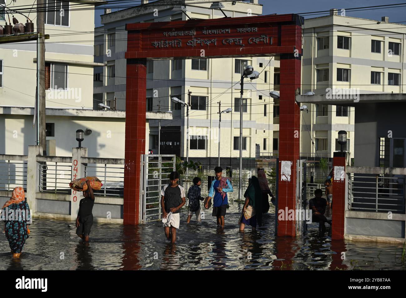 Flood affected peoples are take shelter at a school building in Feni ...