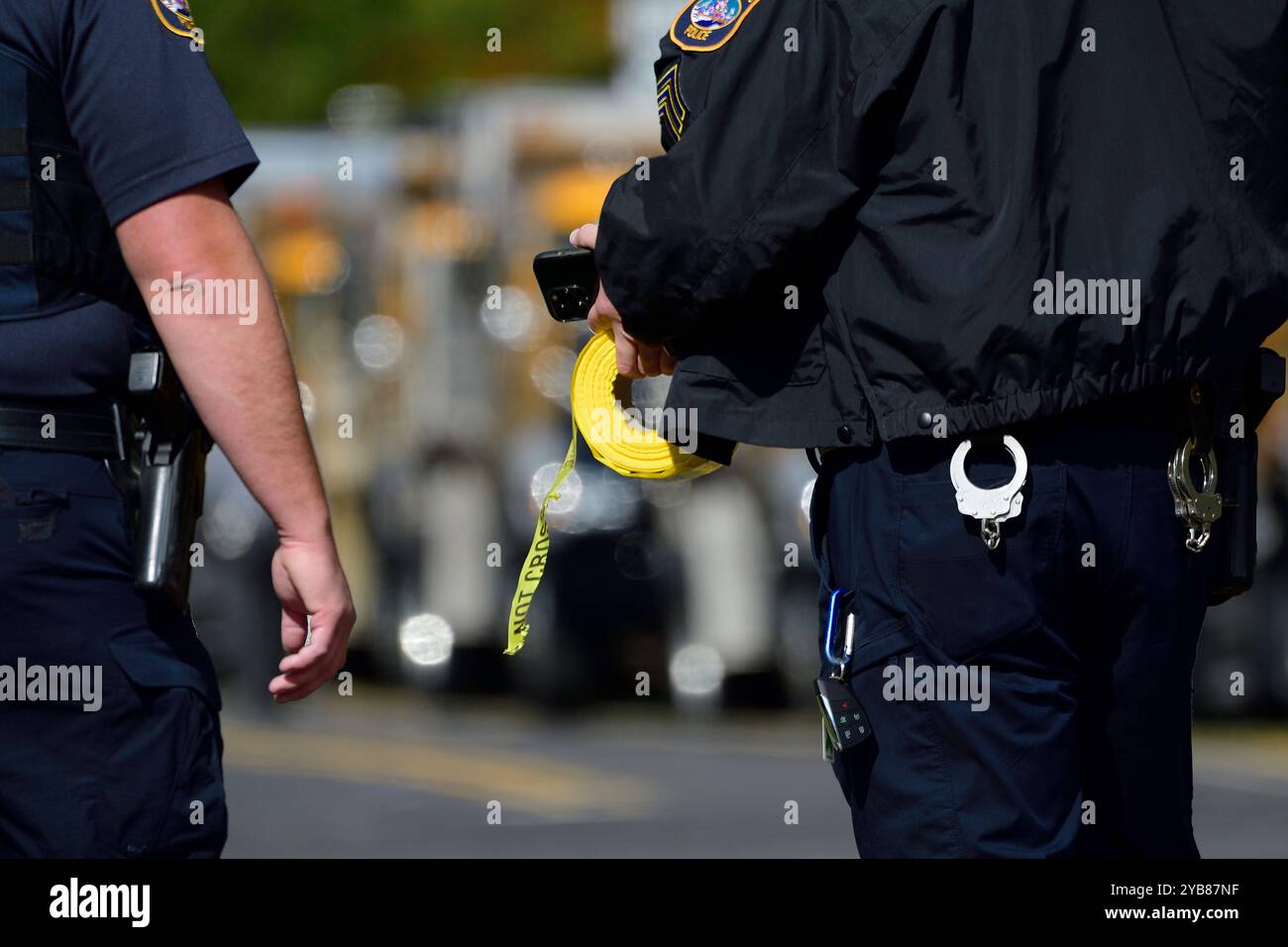 Police officers secure a perimeter during an October 16, 2024 political ...
