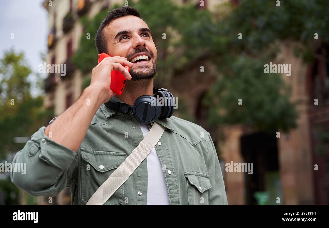 Happy man walking outdoors using hi-res stock photography and images ...