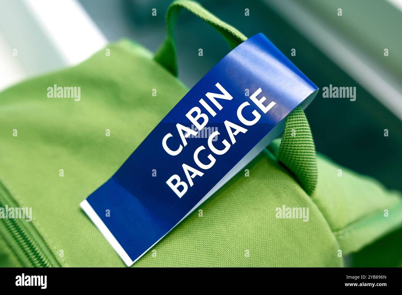 Cabin baggage close-up of tag on green backpack at the airport Stock ...