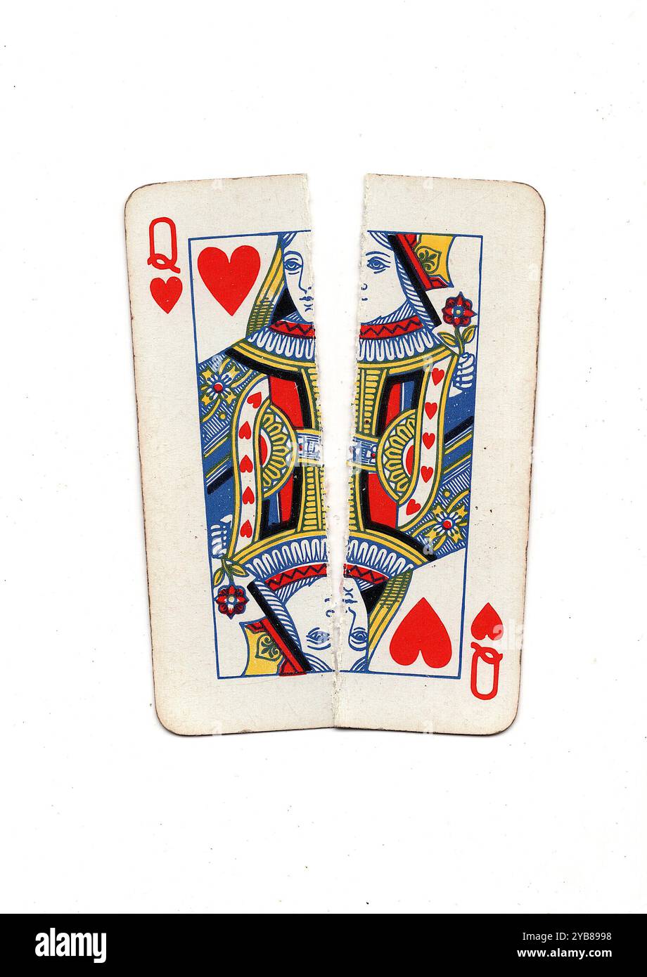 A vintage playing card torn in half from top to bottom on a white ...