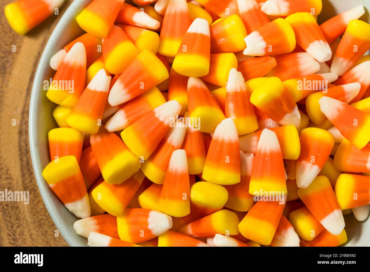 Sweet Sugary Halloween Candy Corn in a Bowl Stock Photo - Alamy