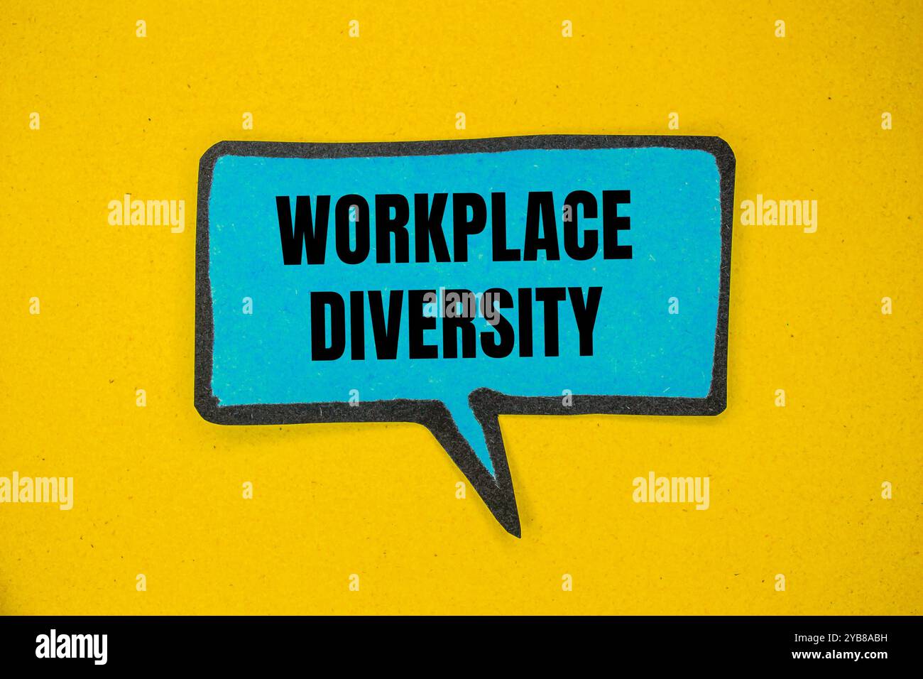 Workplace diversity message written on blue paper speech bubble with ...