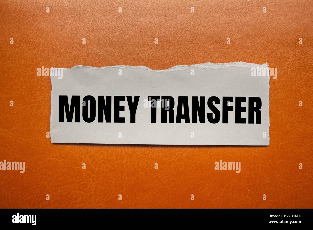Money transfer message written on ripped torn paper piece with brown ...