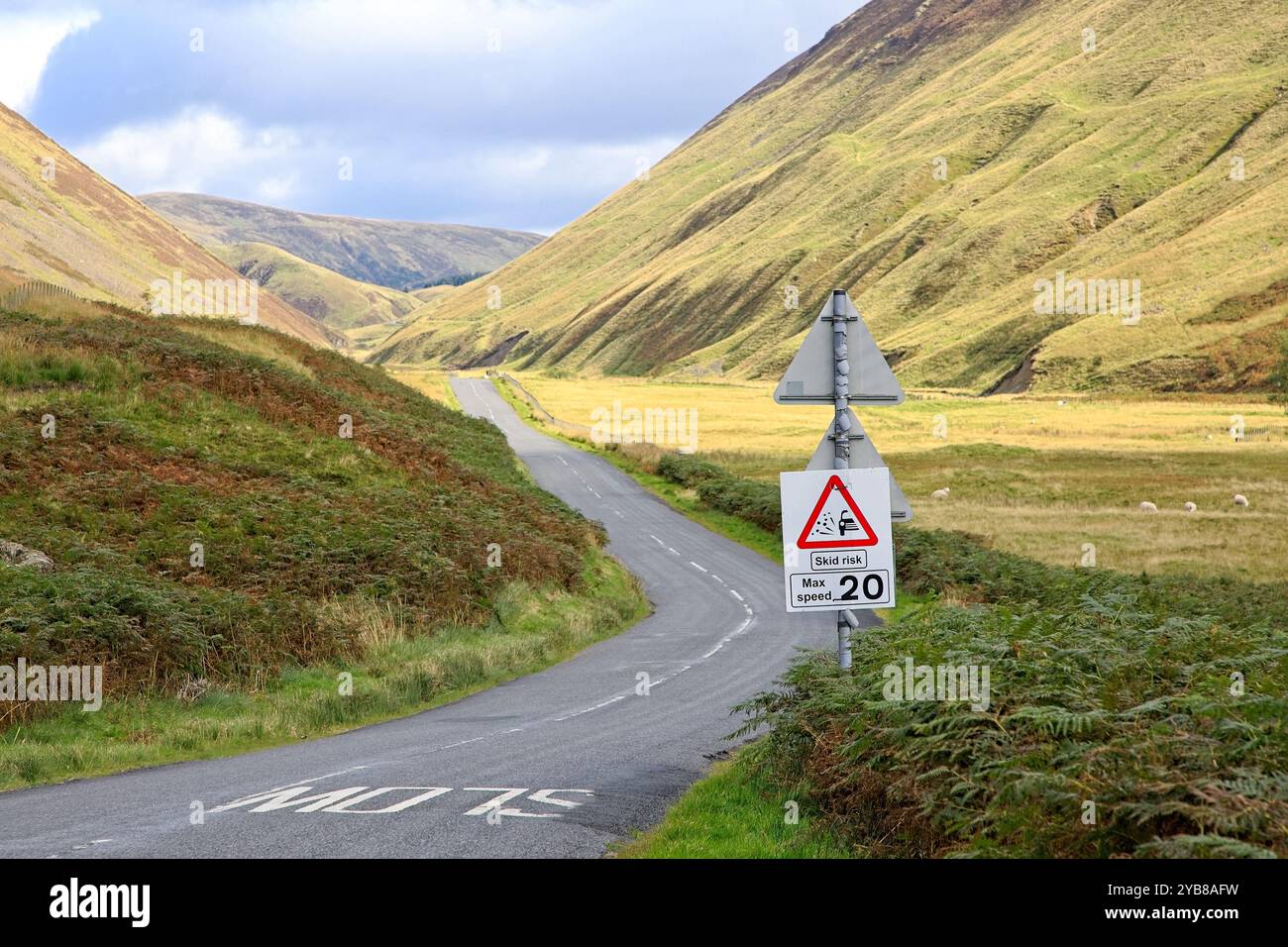 Skid risk sign with a 20mph max speed limet Stock Photo - Alamy