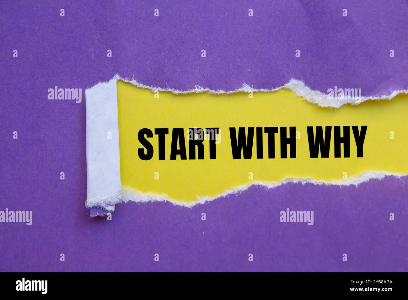 Start with why message written on ripped torn purple paper with yellow ...