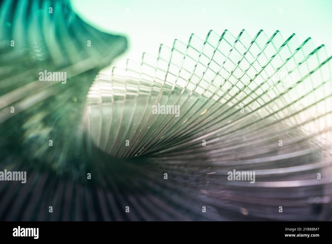 Artistic composition with the close-up of a green glass spiral ...