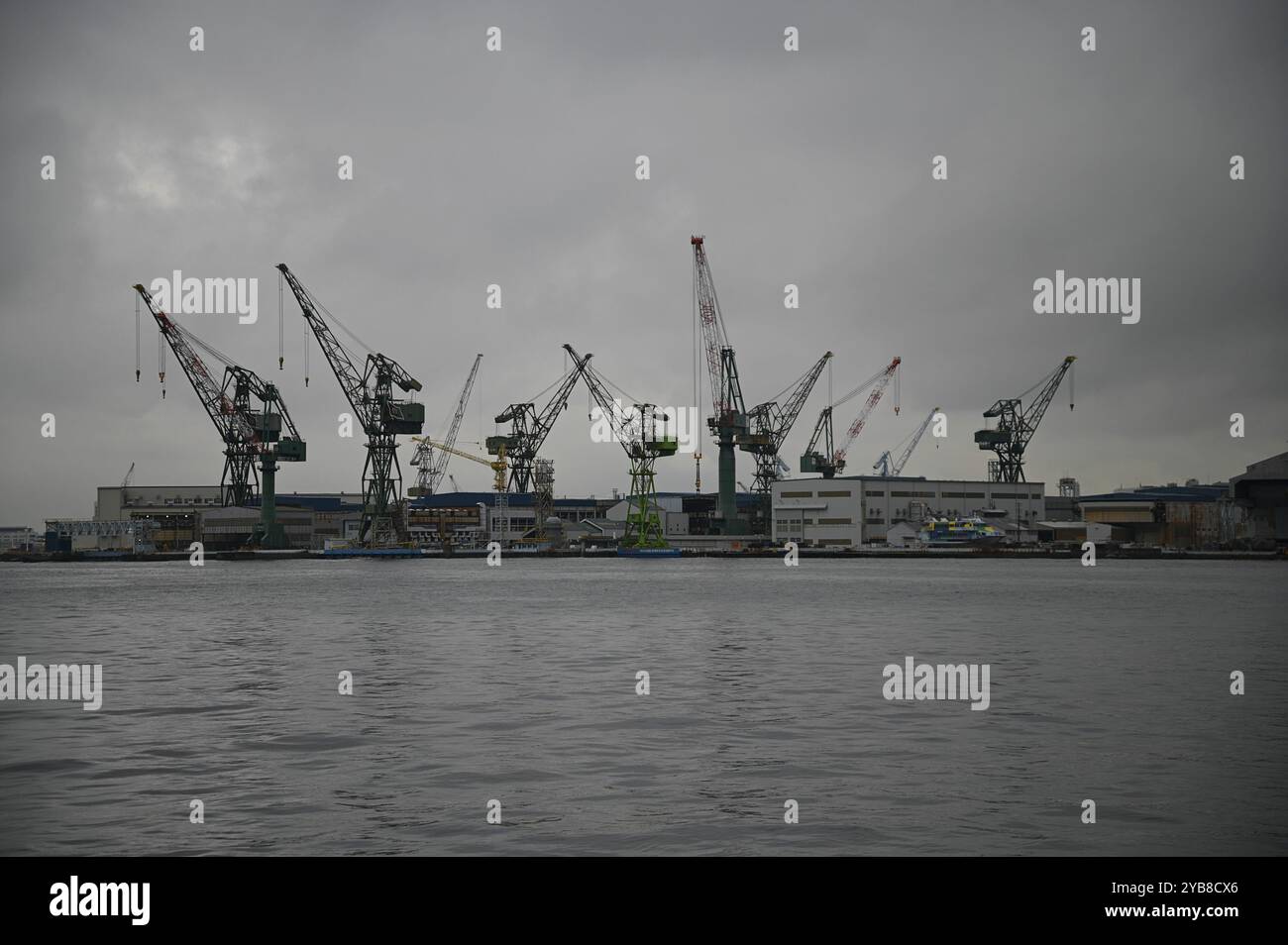 Scenic view of shipyard cranes at the maritime Port of Kōbe in the ...