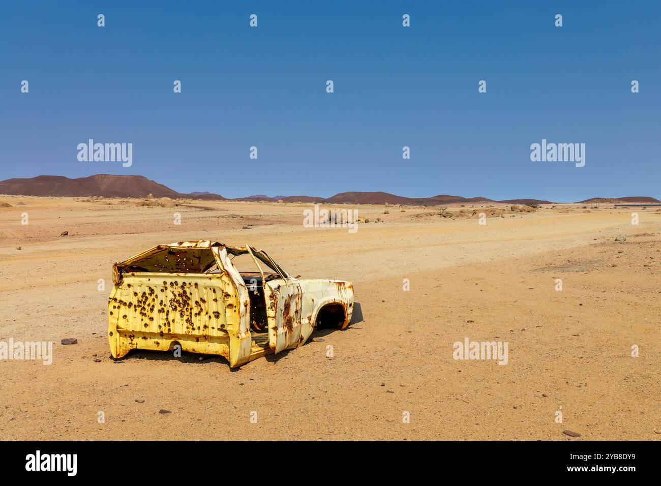 Old rusty yellow car wreck in the desert, Namibia landscape, Africa ...