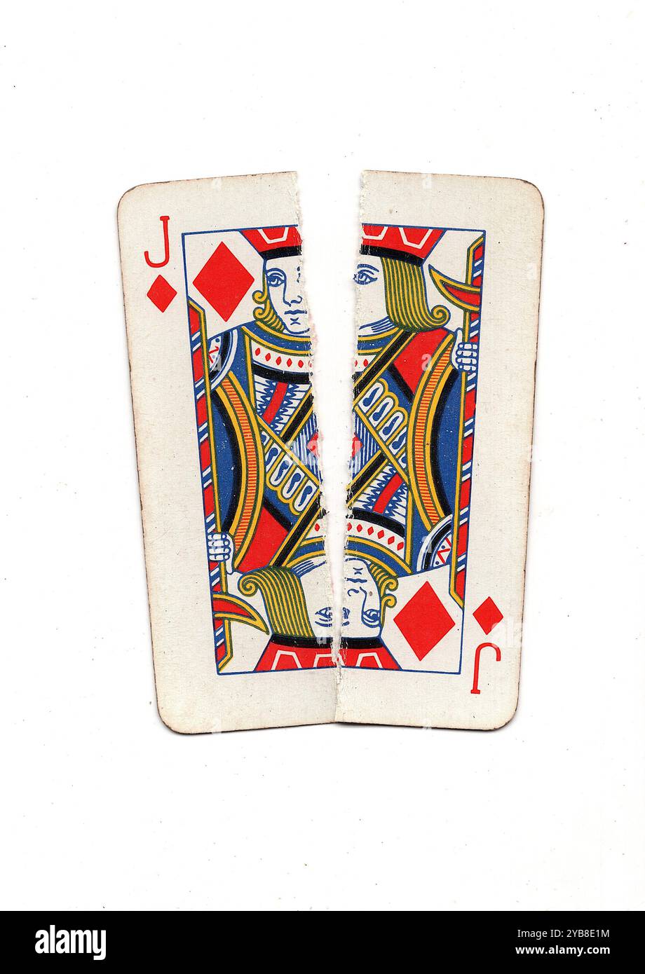 A vintage playing card torn in half from top to bottom on a white ...