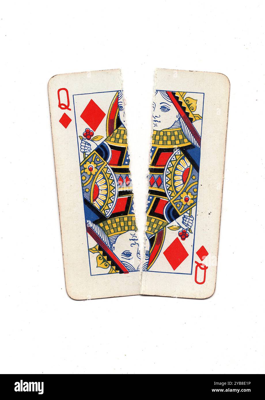 A vintage playing card torn in half from top to bottom on a white ...