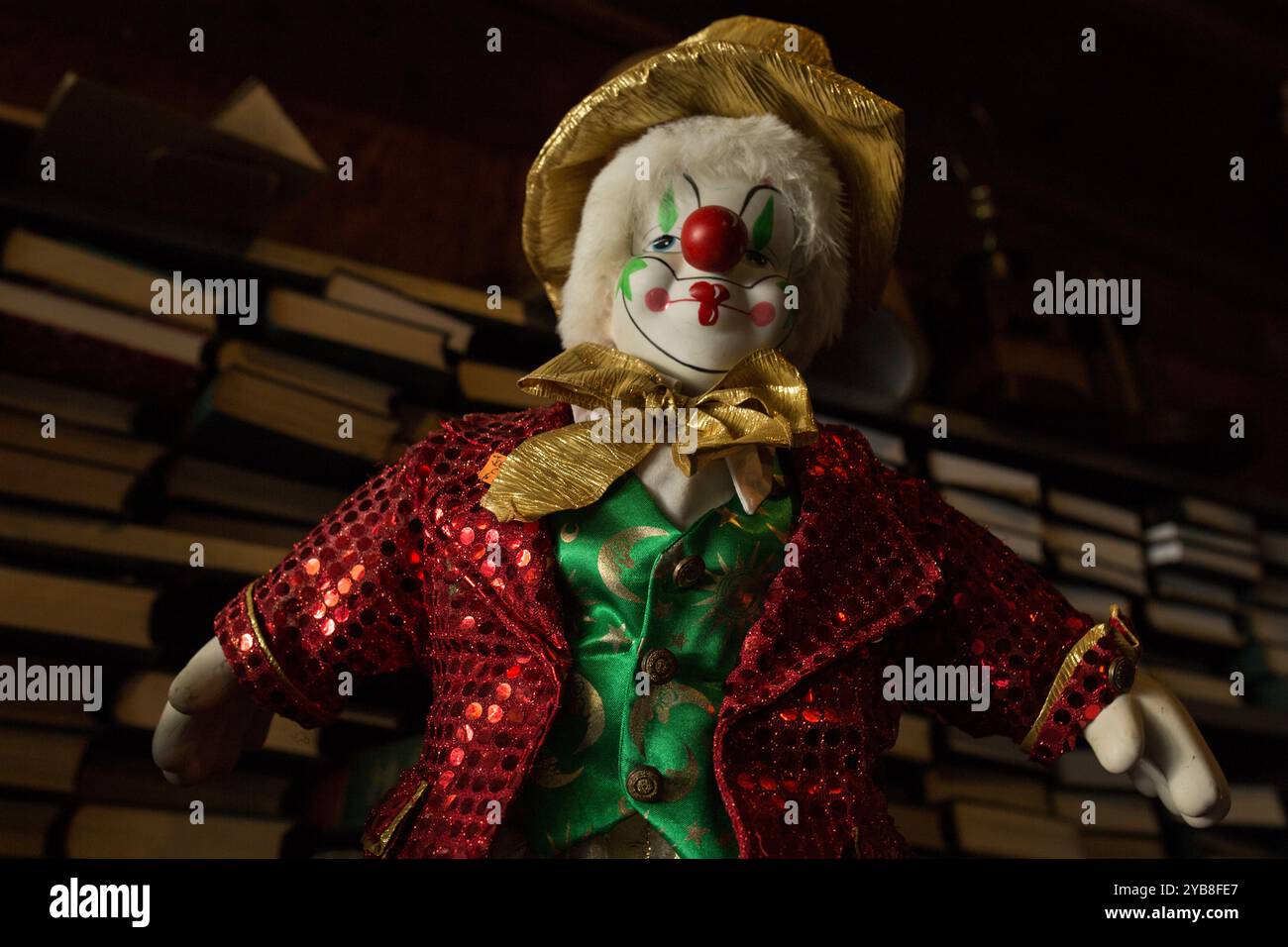 Antique Circus Clown Doll and Old Library Books Background Stock Photo ...