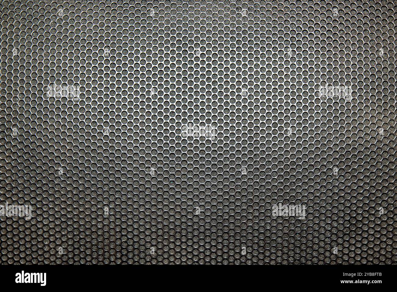 Photo of a real metal speaker grill showing the black grill and padding ...