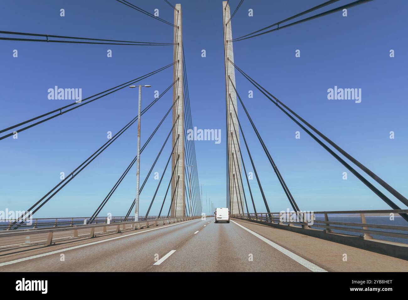 High-speed road bridge view from a fast-moving car. Road and railway ...