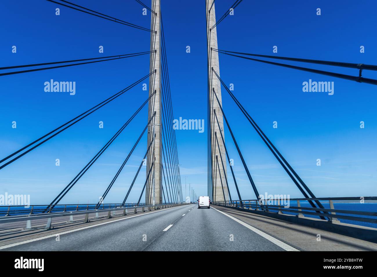 High-speed road bridge view from a fast-moving car. Road and railway ...