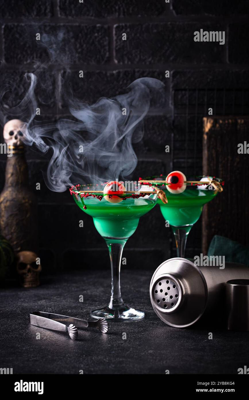 Spooky green halloween cocktails with smoke Stock Photo - Alamy