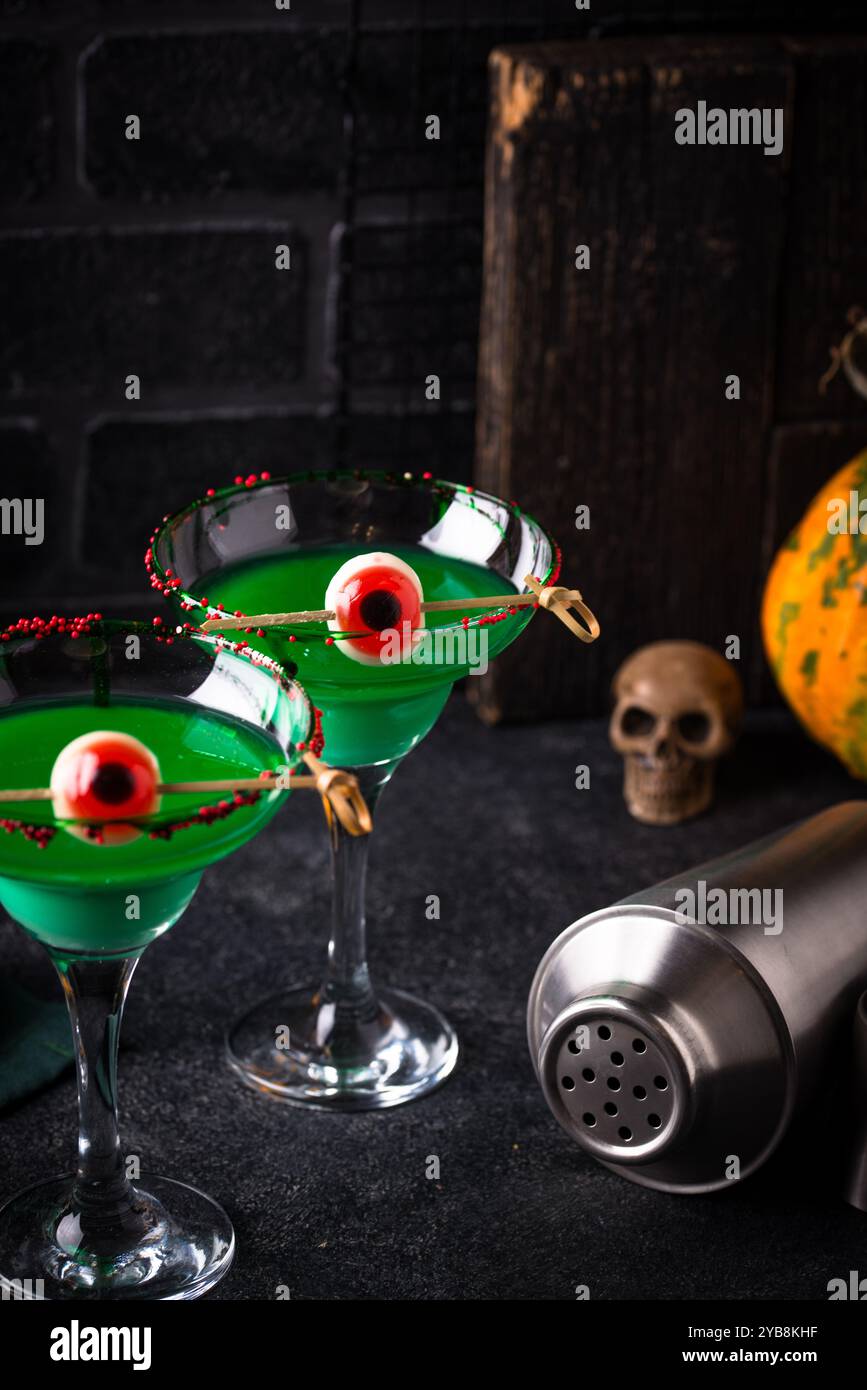 Spooky green halloween martinis with eyeballs Stock Photo - Alamy