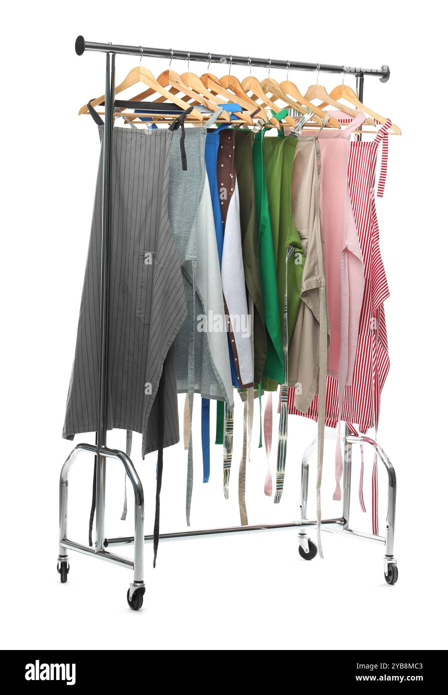 Chef's aprons on clothing rack isolated on white Stock Photo - Alamy